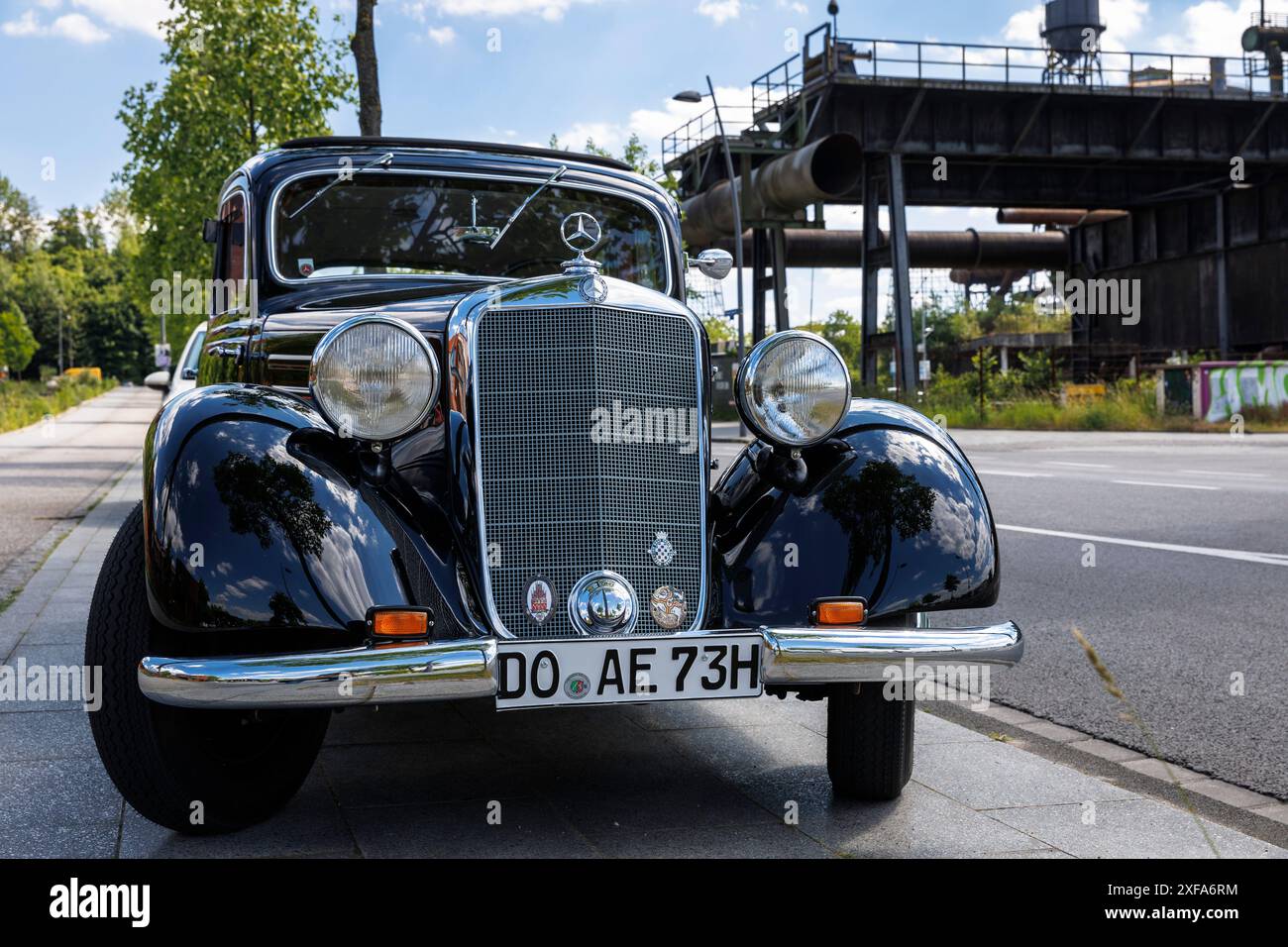 a Mercedes-Benz W 136 stands in front of the blast furnace of the former Hoesch smeltery Phoenix ...