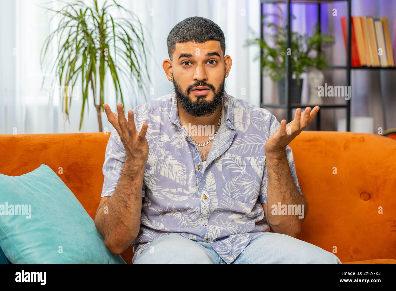 What. Why. Frustrated Indian man raising hands in indignant expression ...