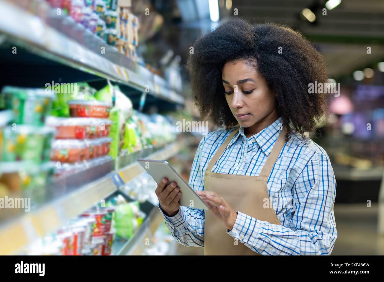 Focused hispanic woman checks hi-res stock photography and images - Alamy