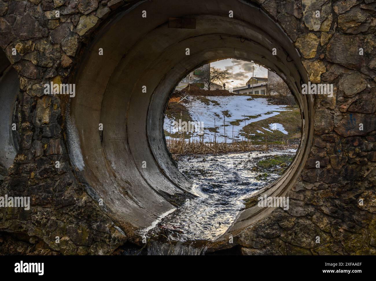 water overflow under the bridge in Aizkraukle in Latvia Stock Photo - Alamy