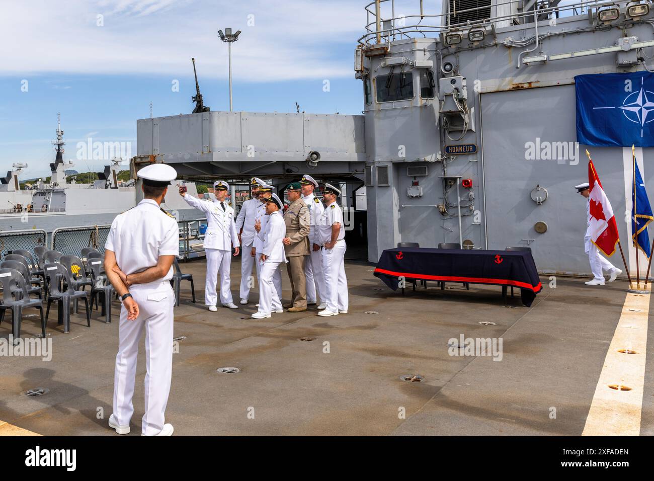 Military sailors take a souvenir photo at the end of the ceremony ...