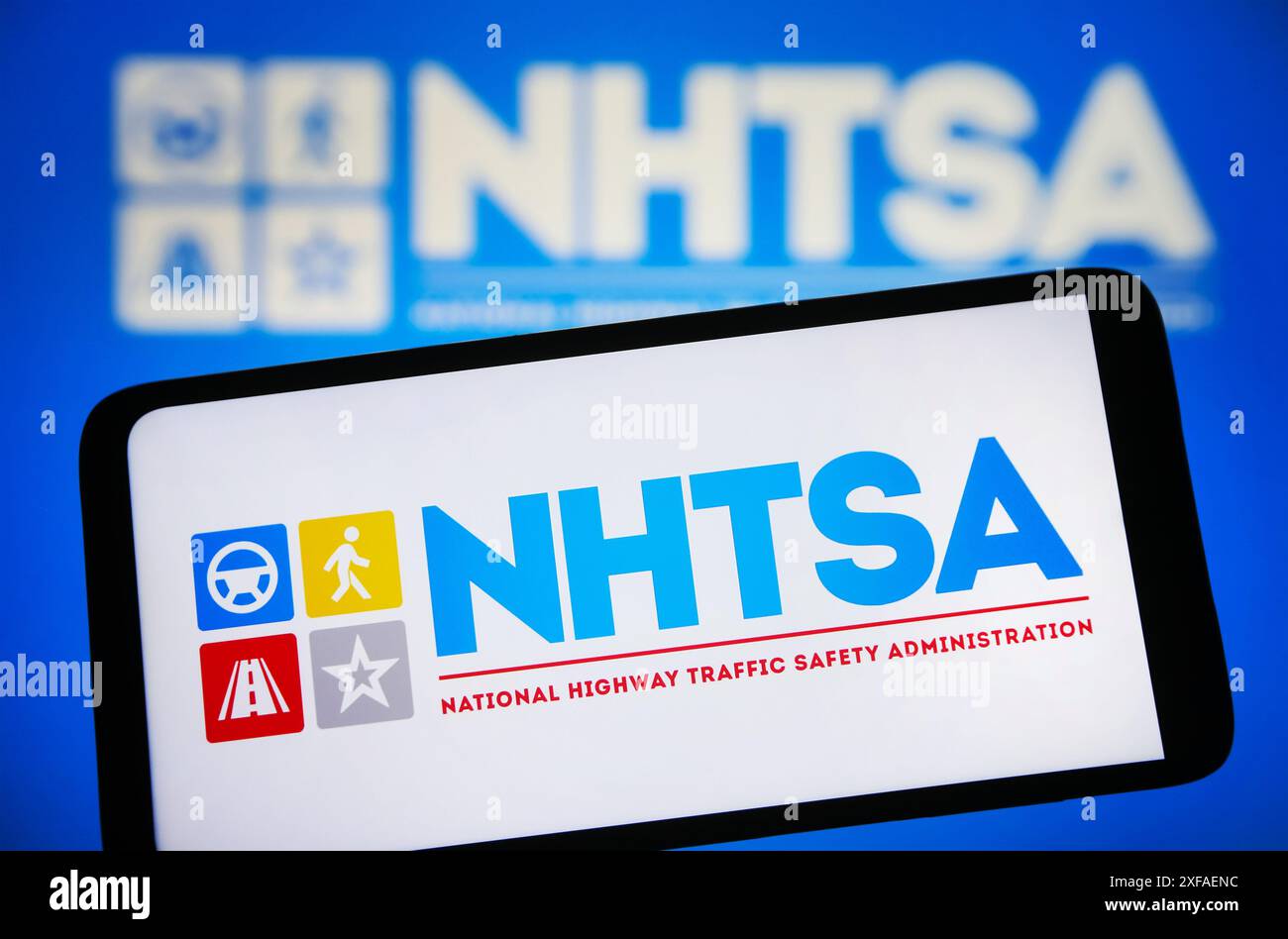 In this photo illustration, a National Highway Traffic Safety ...