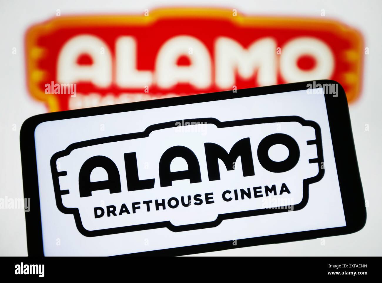 In this photo illustration, an Alamo Drafthouse Cinema logo is seen on ...