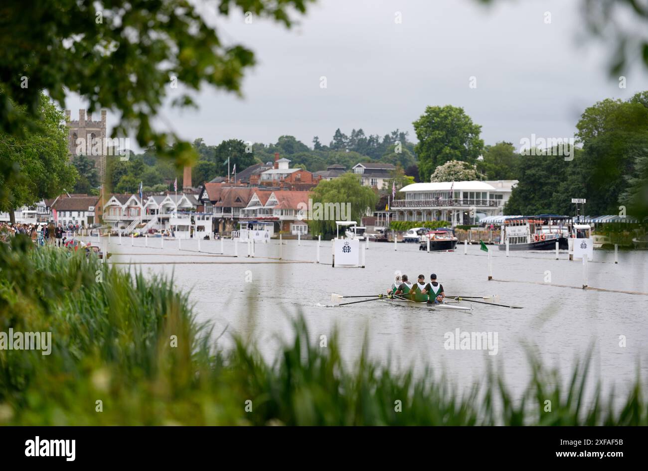 A crew row down to the start line on the opening day of the 2024 Henley ...