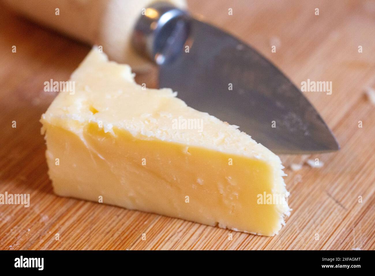 Berlin, Germany. 02nd July, 2024. ILLUSTRATION - A piece of cheddar ...