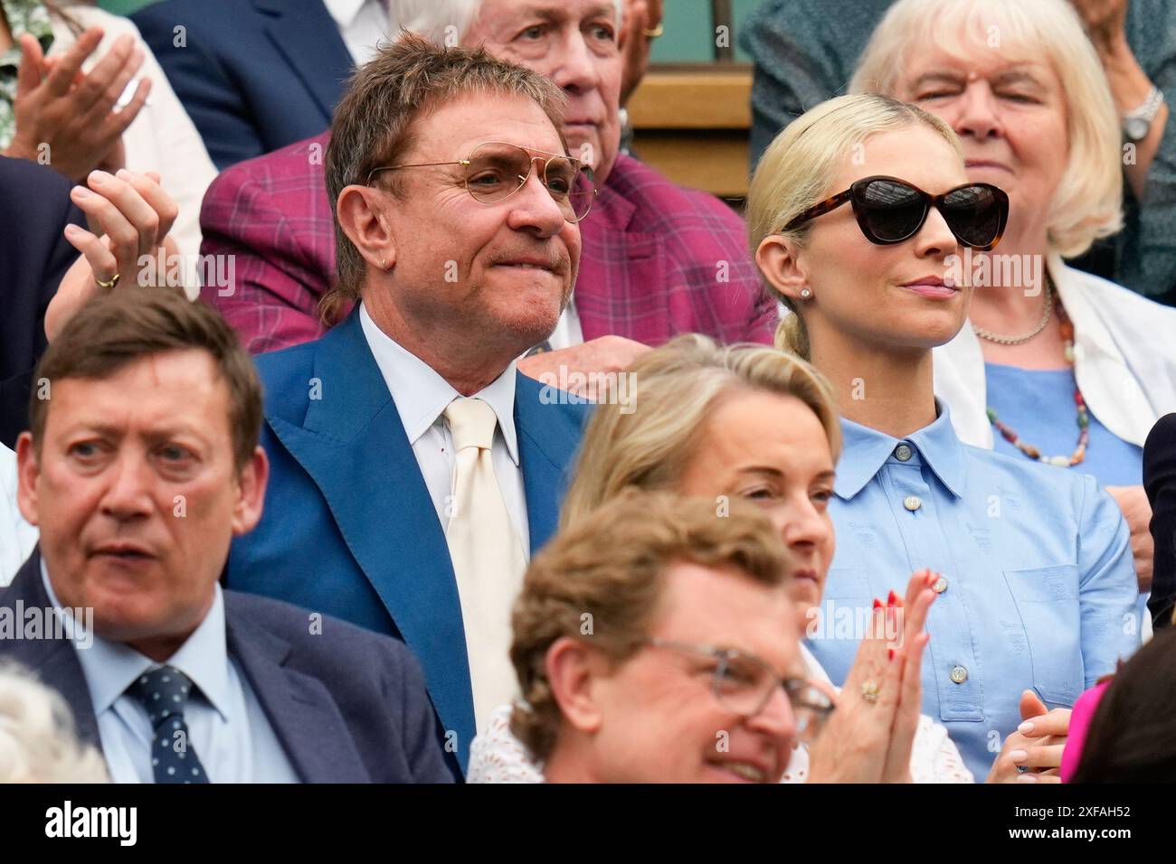 CORRECTS ID Simon Le Bon sits next to Jordyn Blum as they watch play on ...