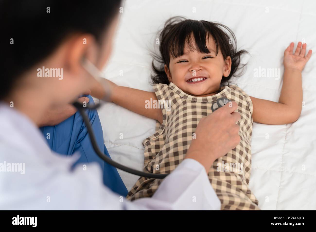 doctor using a stethoscope to istening toddler's chest. baby health ...