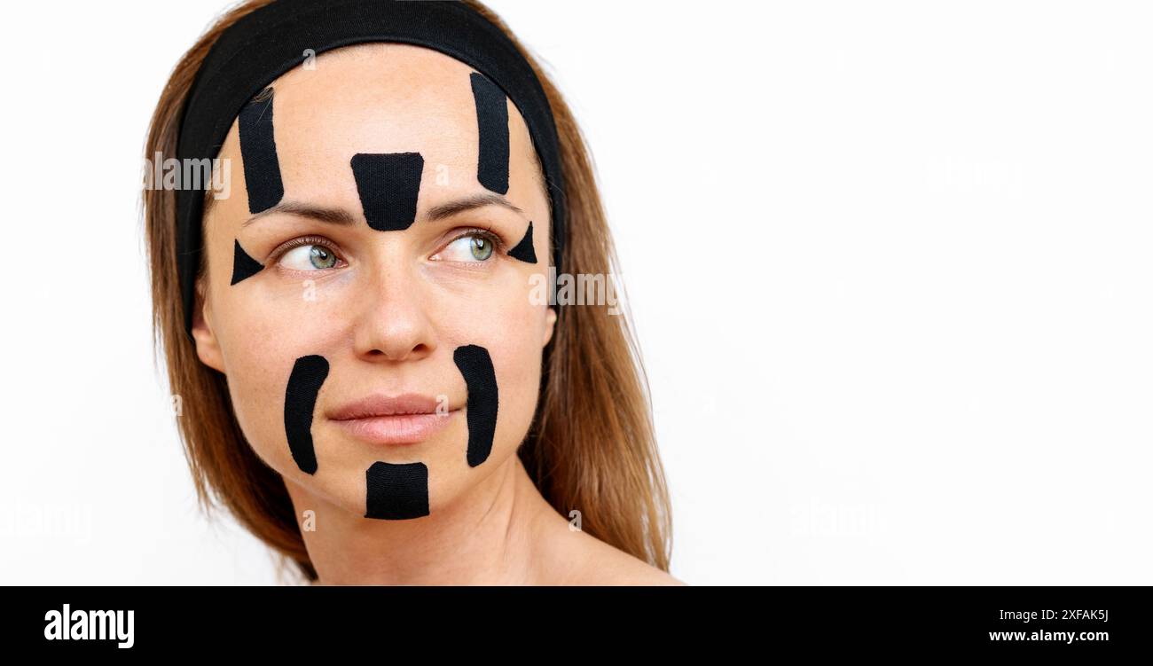 Advertising of black coloured facial countering tapes. Female beauty ...