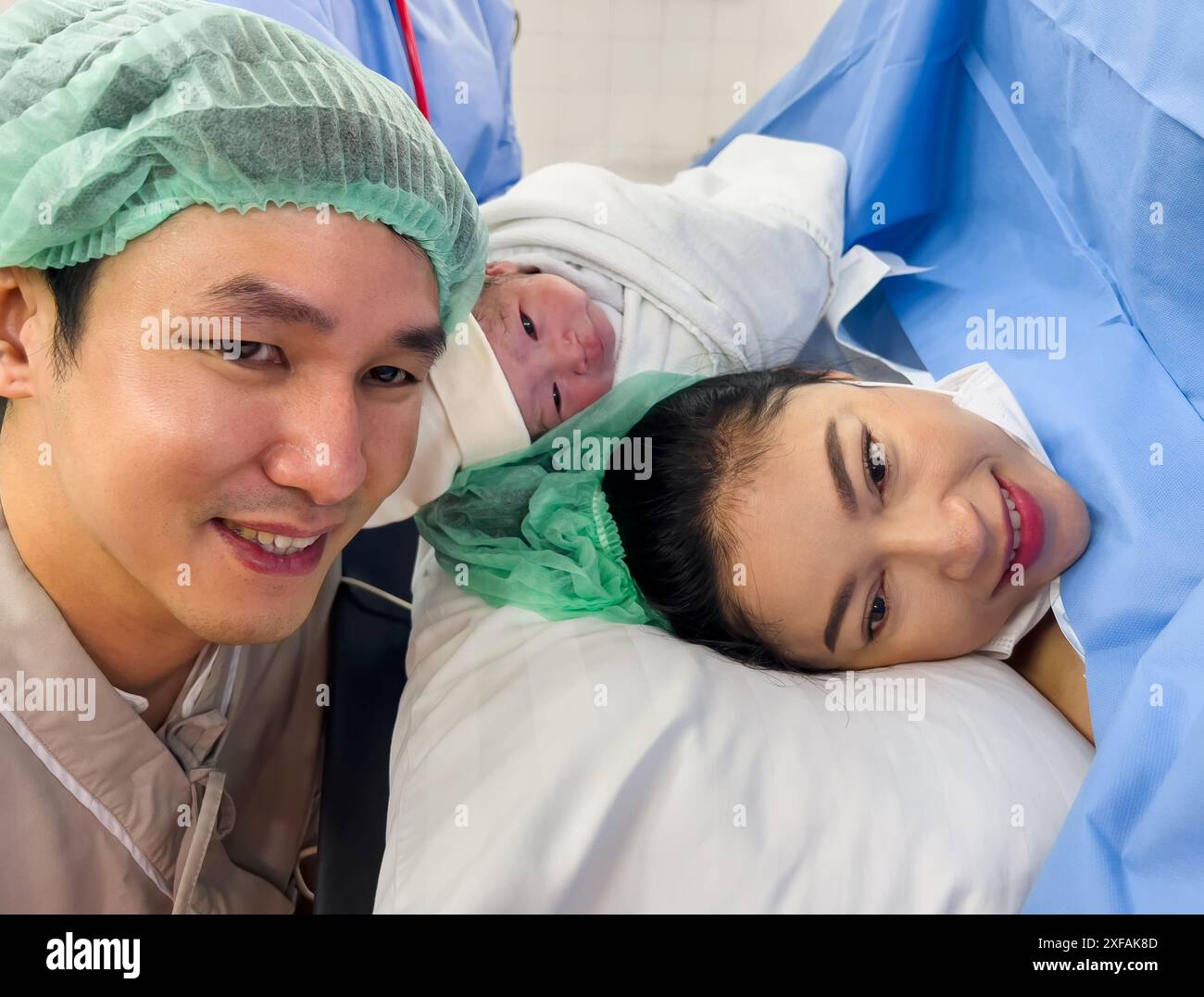 first sight of father and mother with their newborn baby after the ...