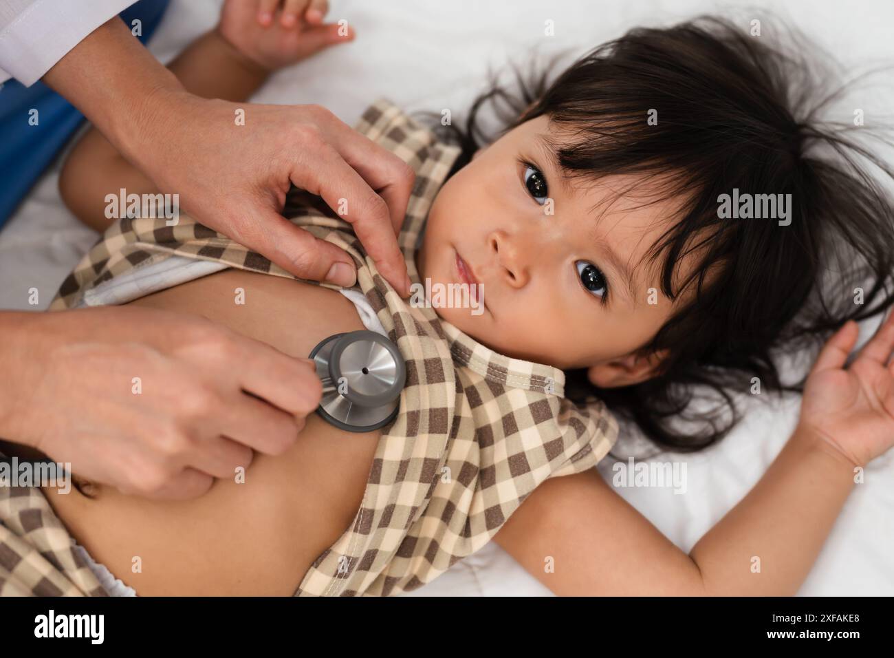 doctor using a stethoscope to istening toddler's chest. baby health ...