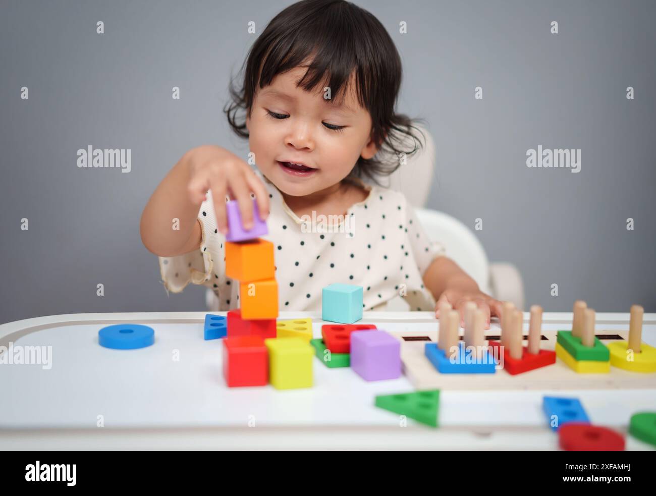 Boy girl playing cubes hi-res stock photography and images - Alamy