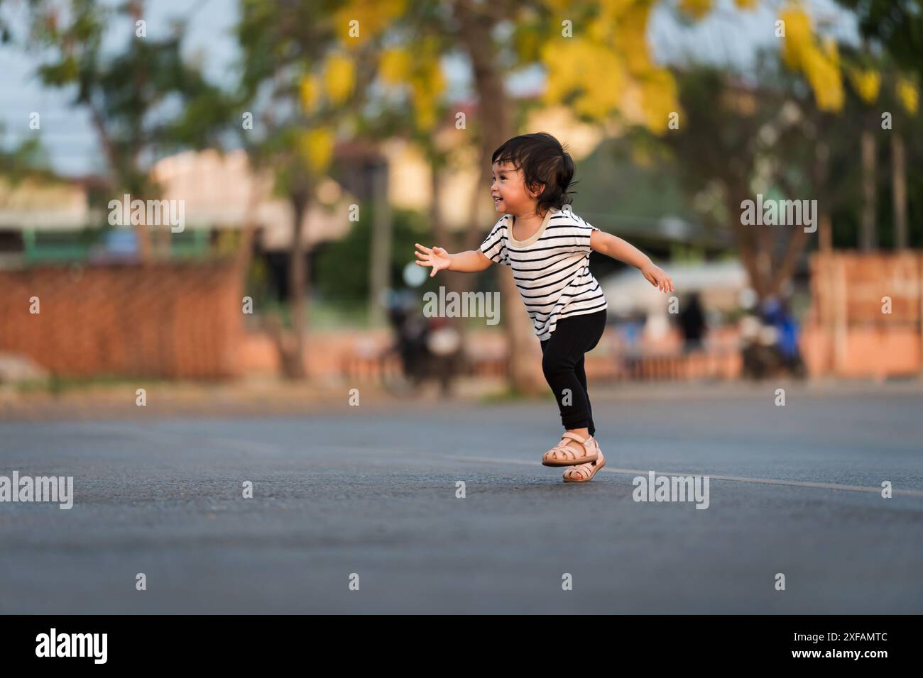 happy toddler girl running in the park Stock Photo - Alamy