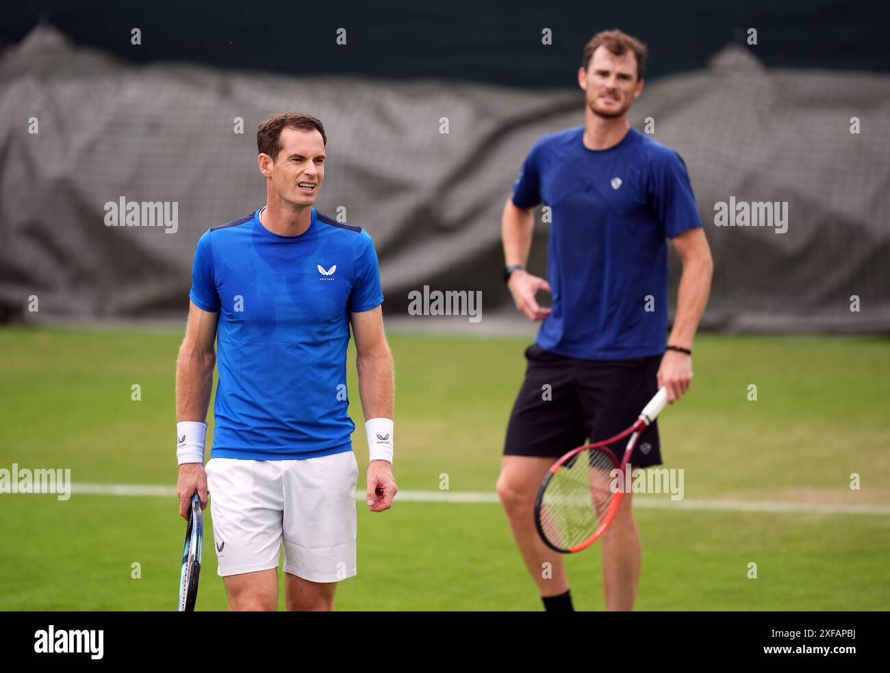 Andy Murray and Jamie Murray (right) on the practise courts on day two ...