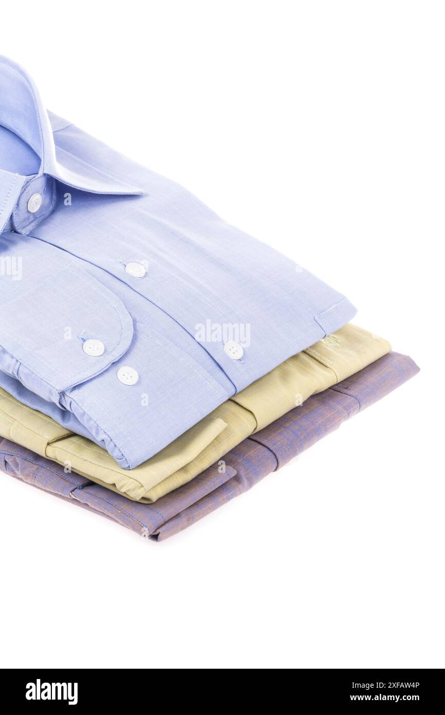 Some folded shirts isolated on white Stock Photo - Alamy