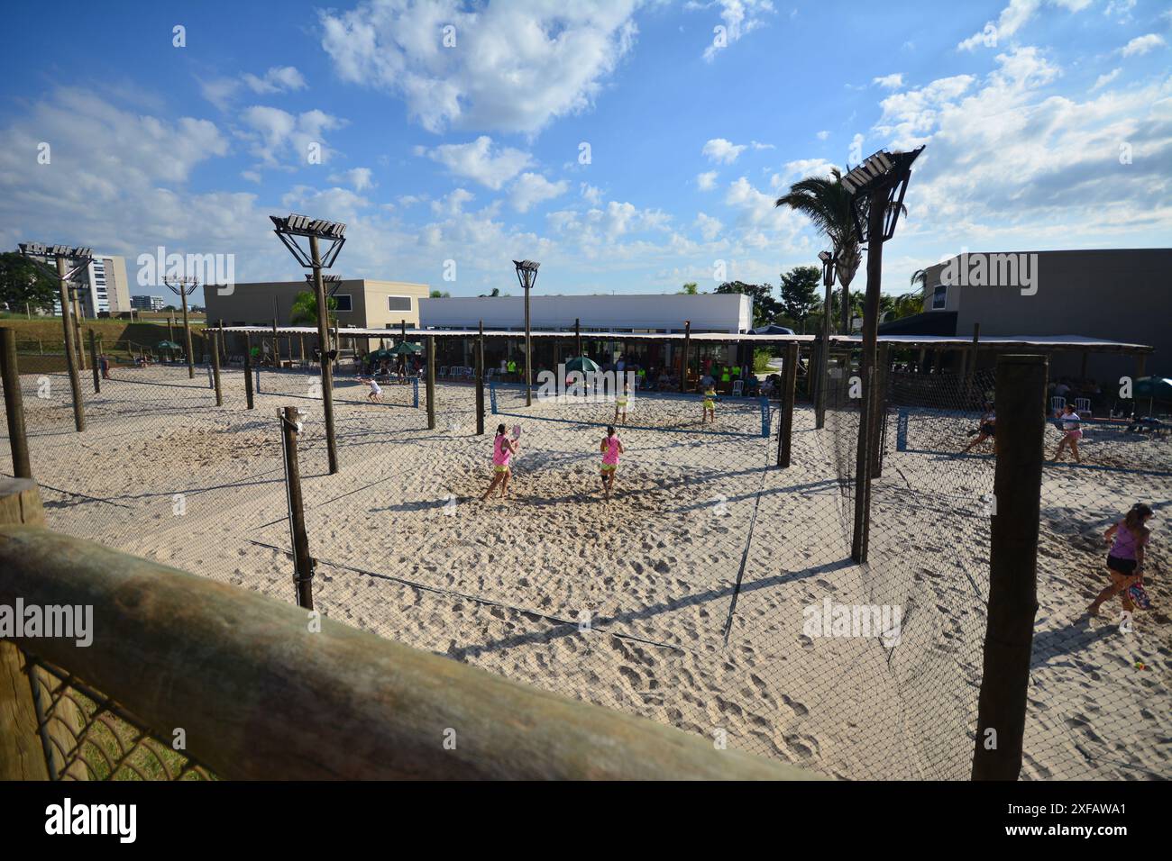 Athletes playing in beach tennis competition Stock Photo - Alamy