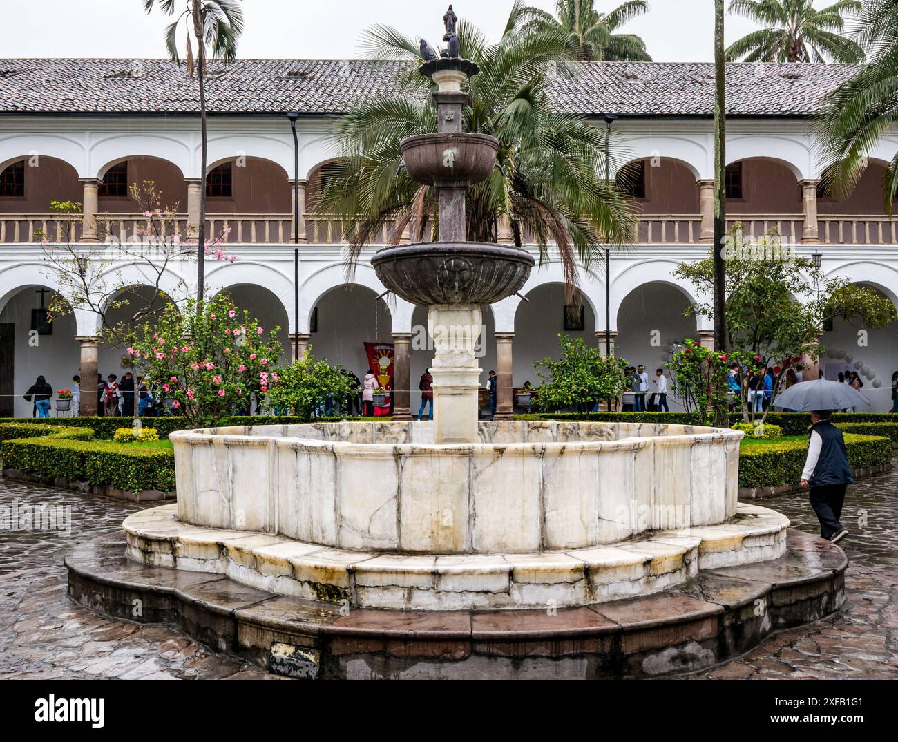 Courtyard with fountain and palm trees in San Francisco convent, Quito ...