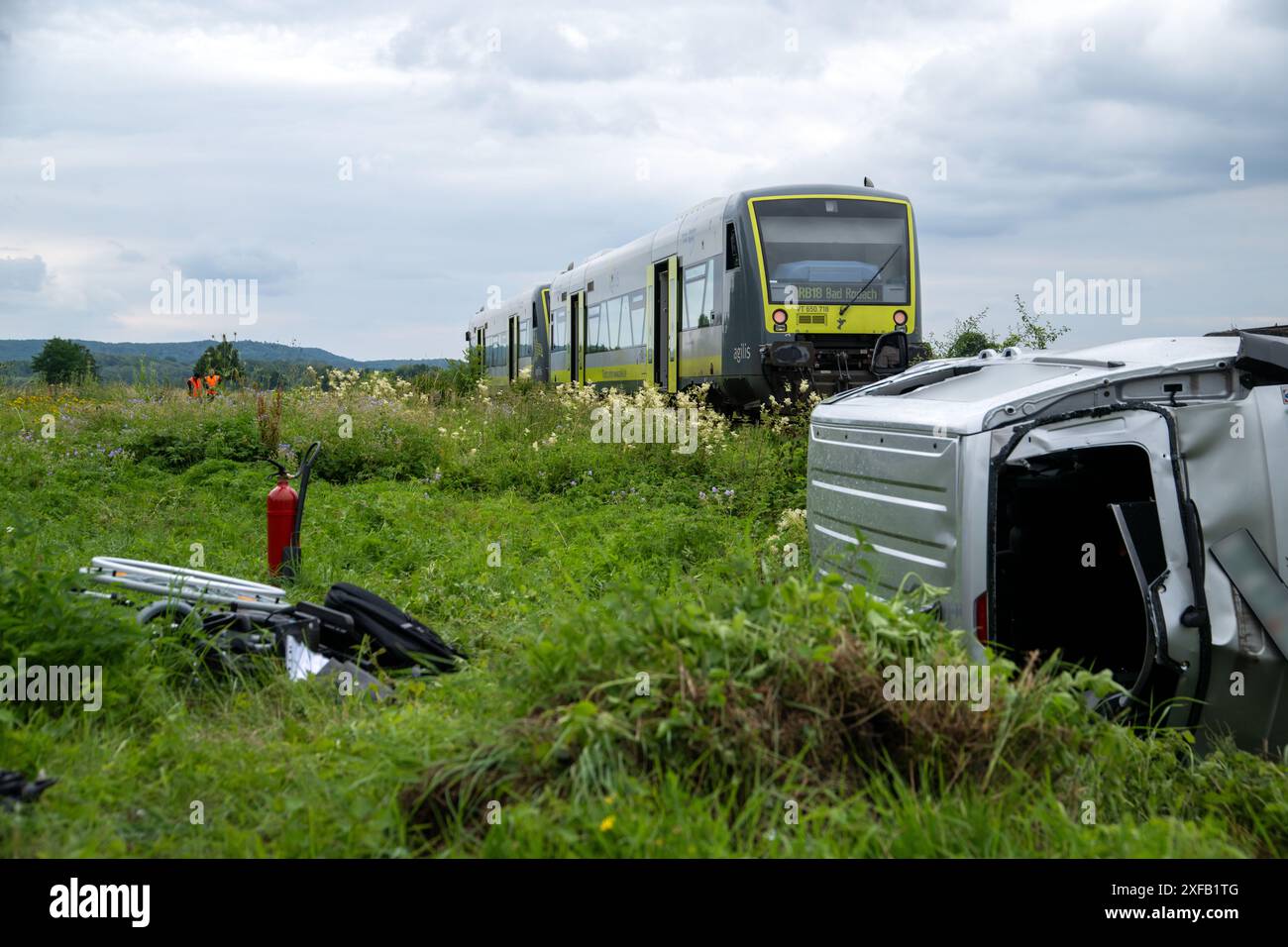 Meeder, Germany. 02nd July, 2024. A car lies damaged next to the tracks ...