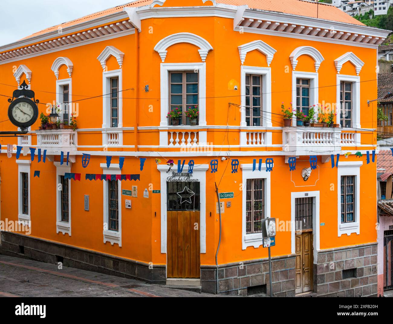 Colourful orange colonial style building, Quito Old Town, Ecuador ...