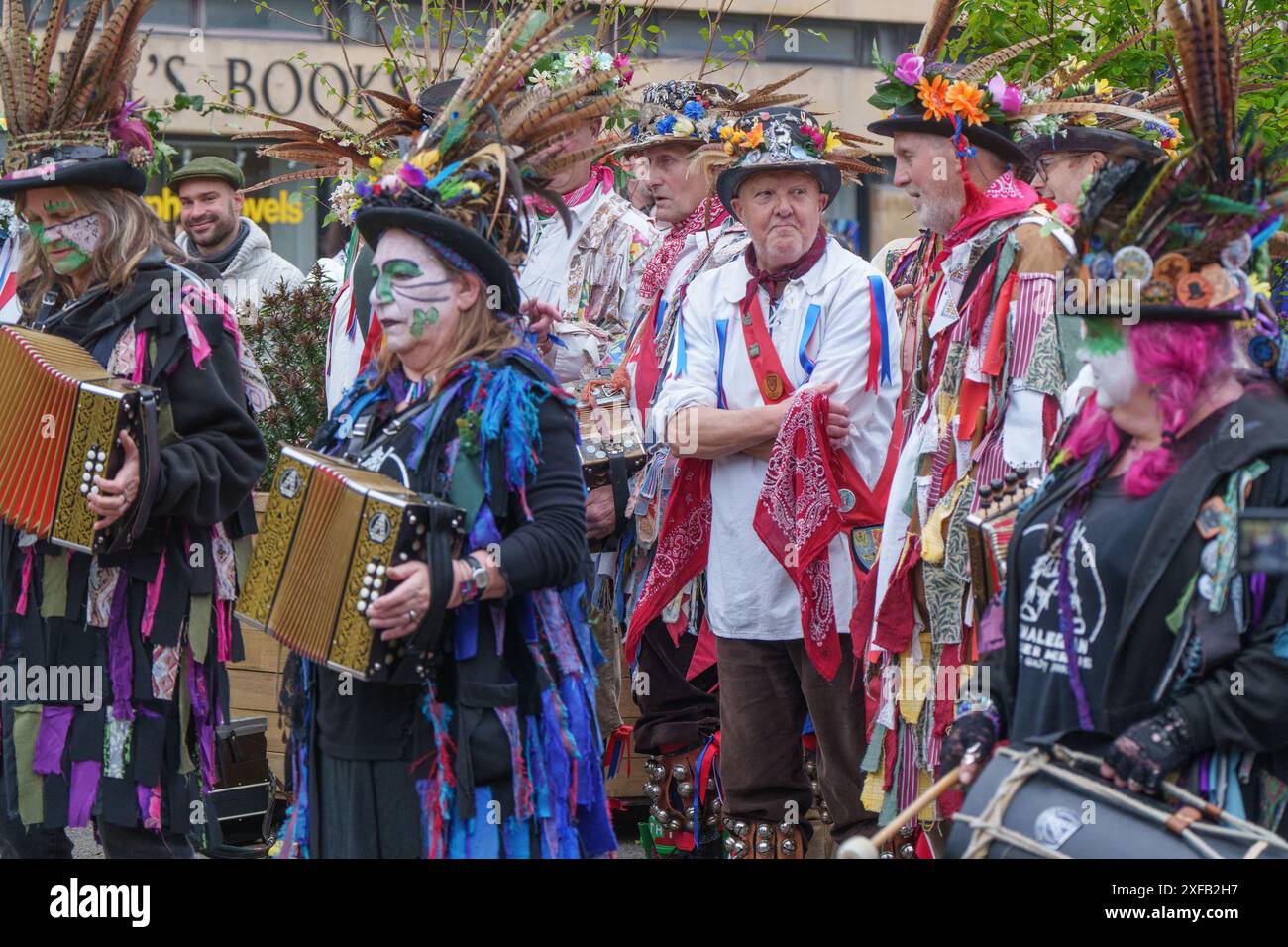 Members of the Armaleggan Border Morris (in black, with painted faces ...