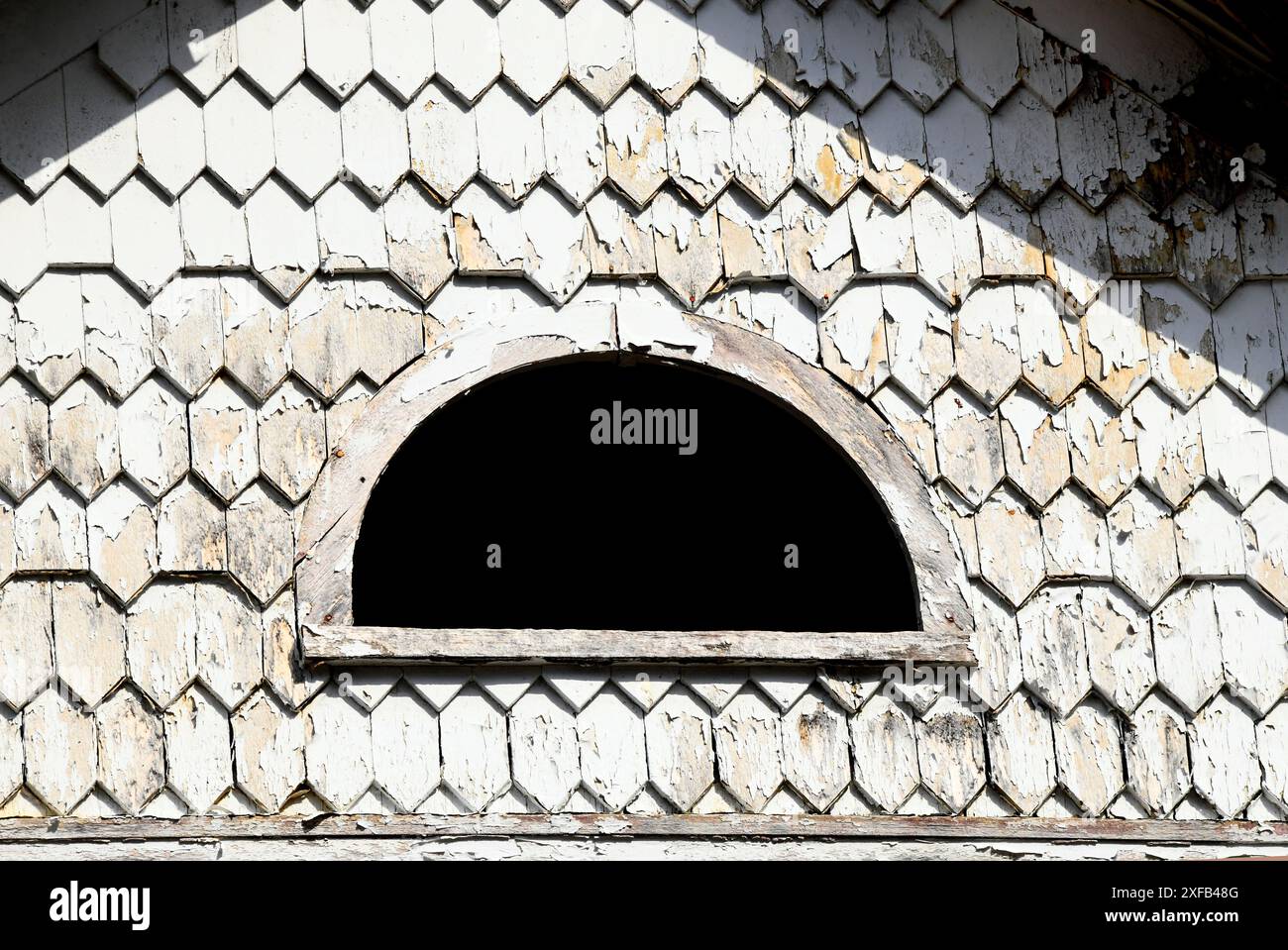 Old Victorian home, has gingerbread trim on eaves. It also has a half ...