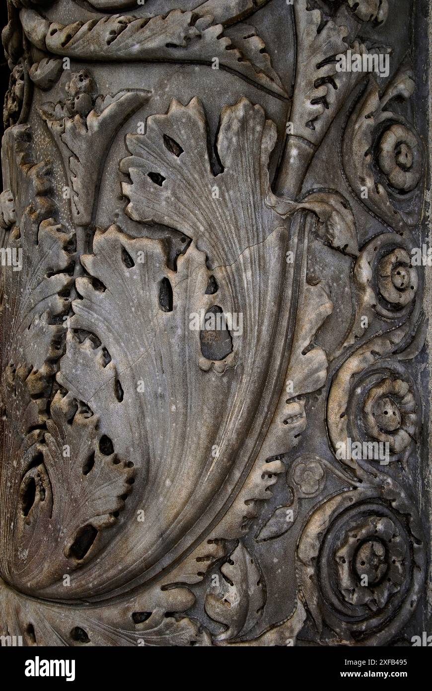 Detail of a finely-sculpted, foliated marble column flanking the East ...