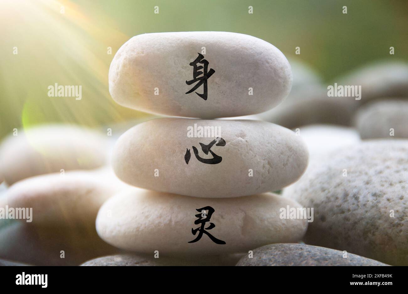 Zen stones with body, mind and spirit in Chinese character with shining ...