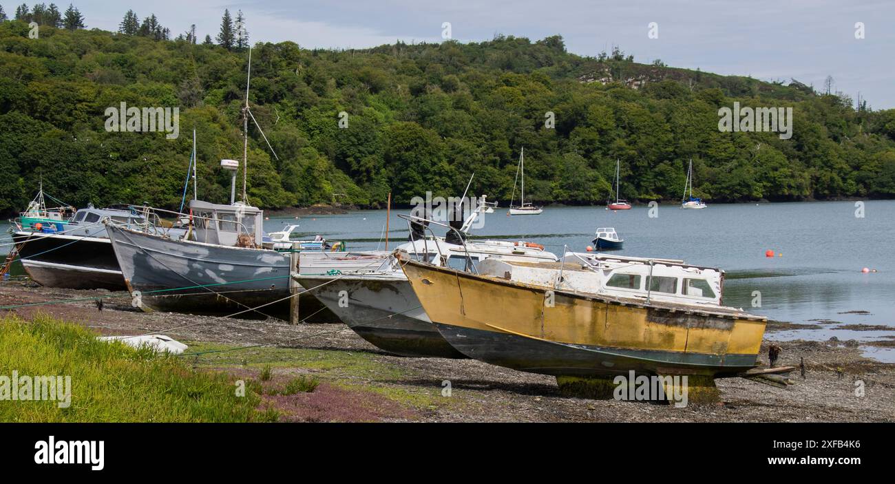 Boats pulled up on shingle beach, West Cork, Ireland Stock Photo - Alamy