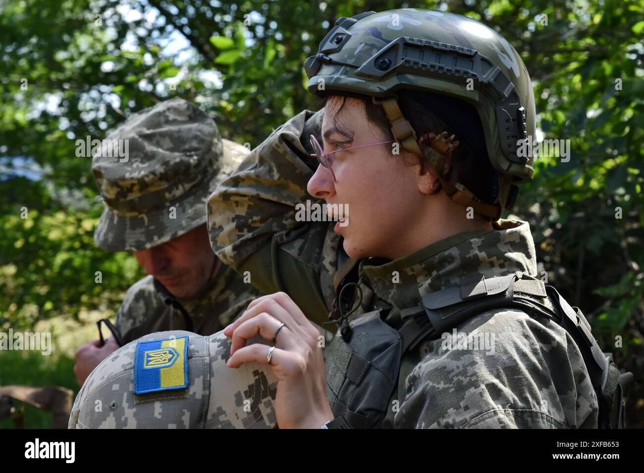 A Ukrainian servicewoman military medic Anastasia, 29 years old (right ...