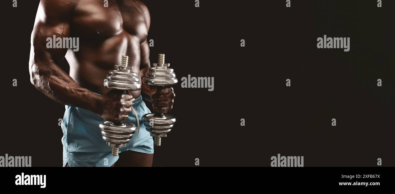 Muscular Man Holding Dumbbells Stock Photo - Alamy