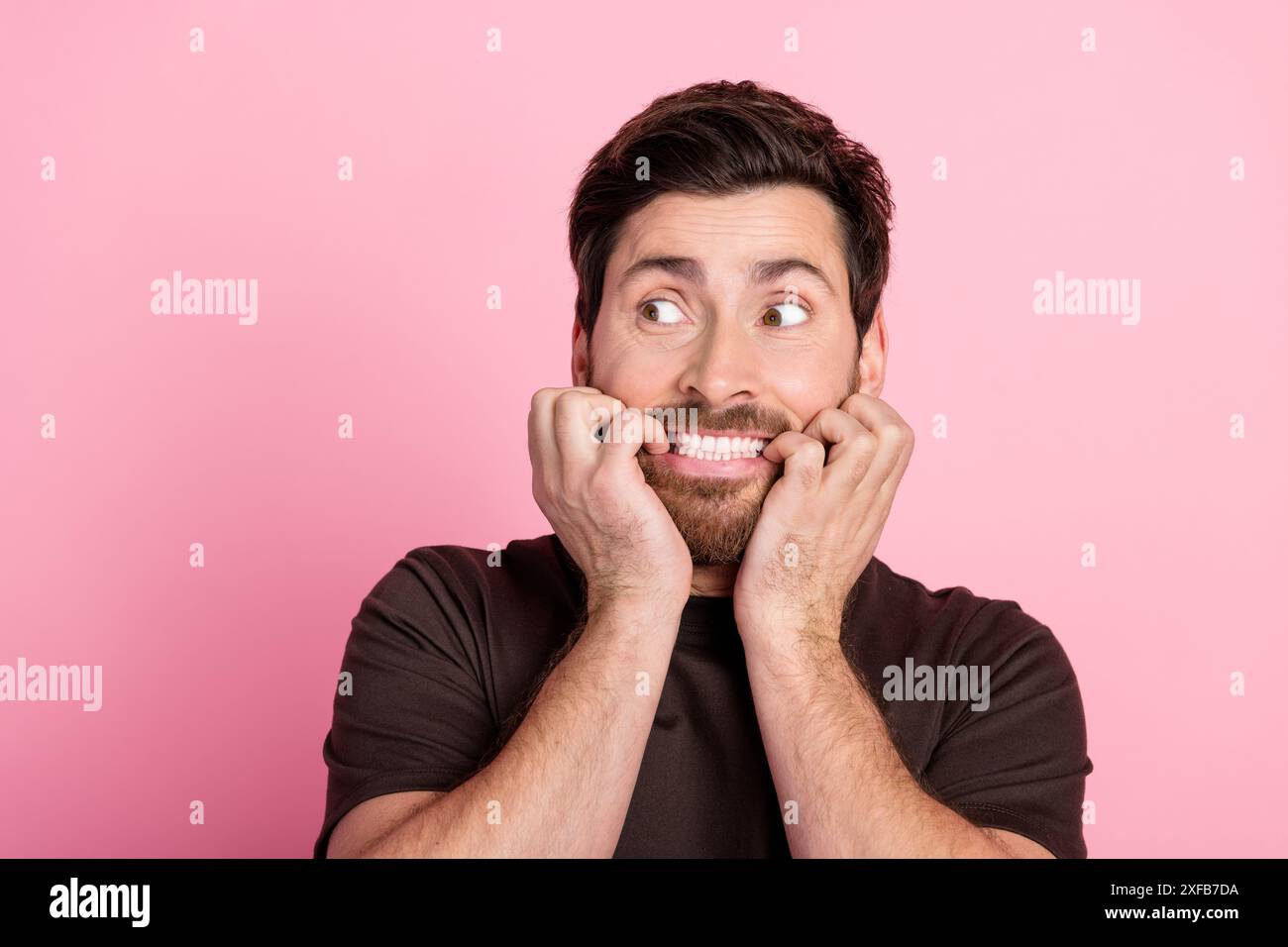 Photo of frightened guy with stubble brunet hair dressed brown t-shirt ...