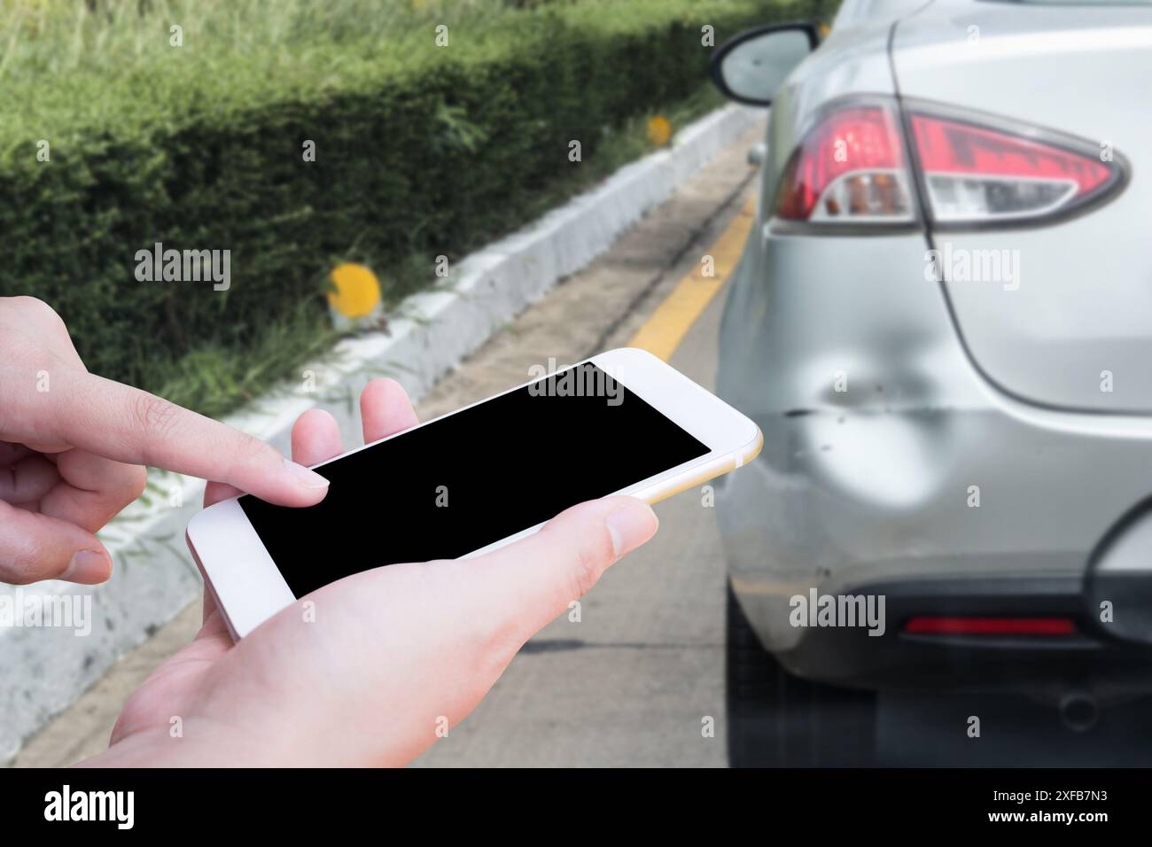 Hand using mobile smart phone after car crash accident damage for ...