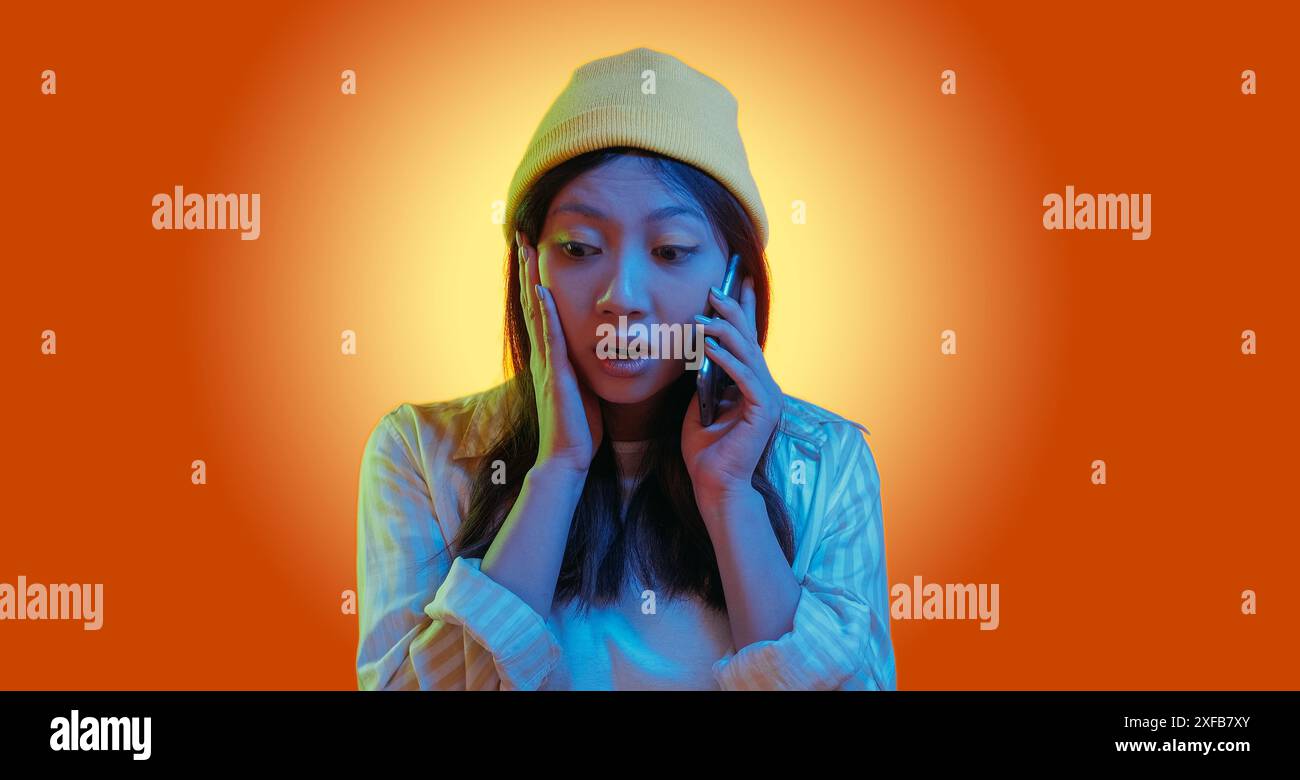 Sad news. Disturbing call. Blue yellow color neon light shocked upset ...