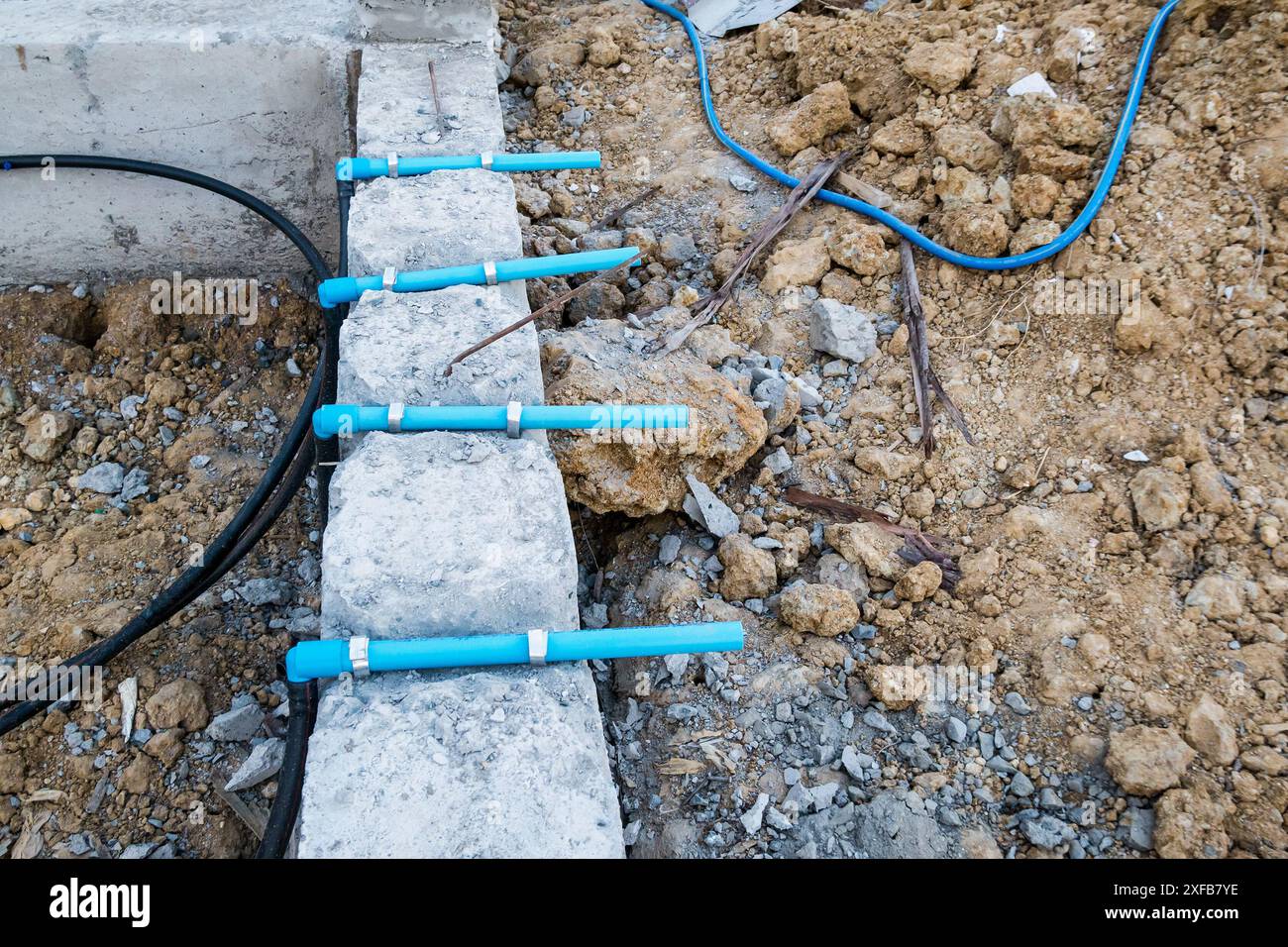 Pest control pipe system install at new house construction foundation ...