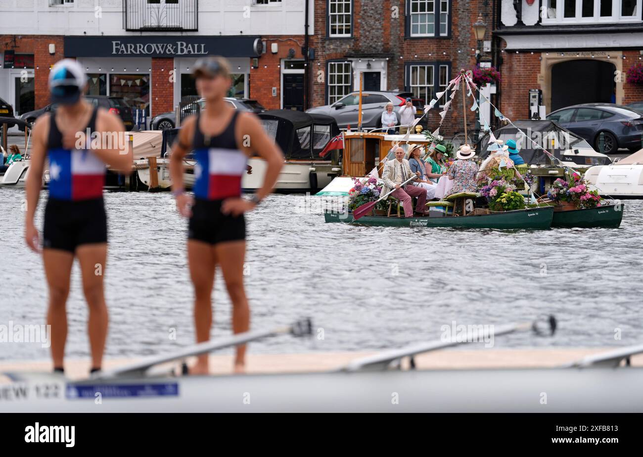 People row a boat along the river Thames on the opening day of the 2024 ...