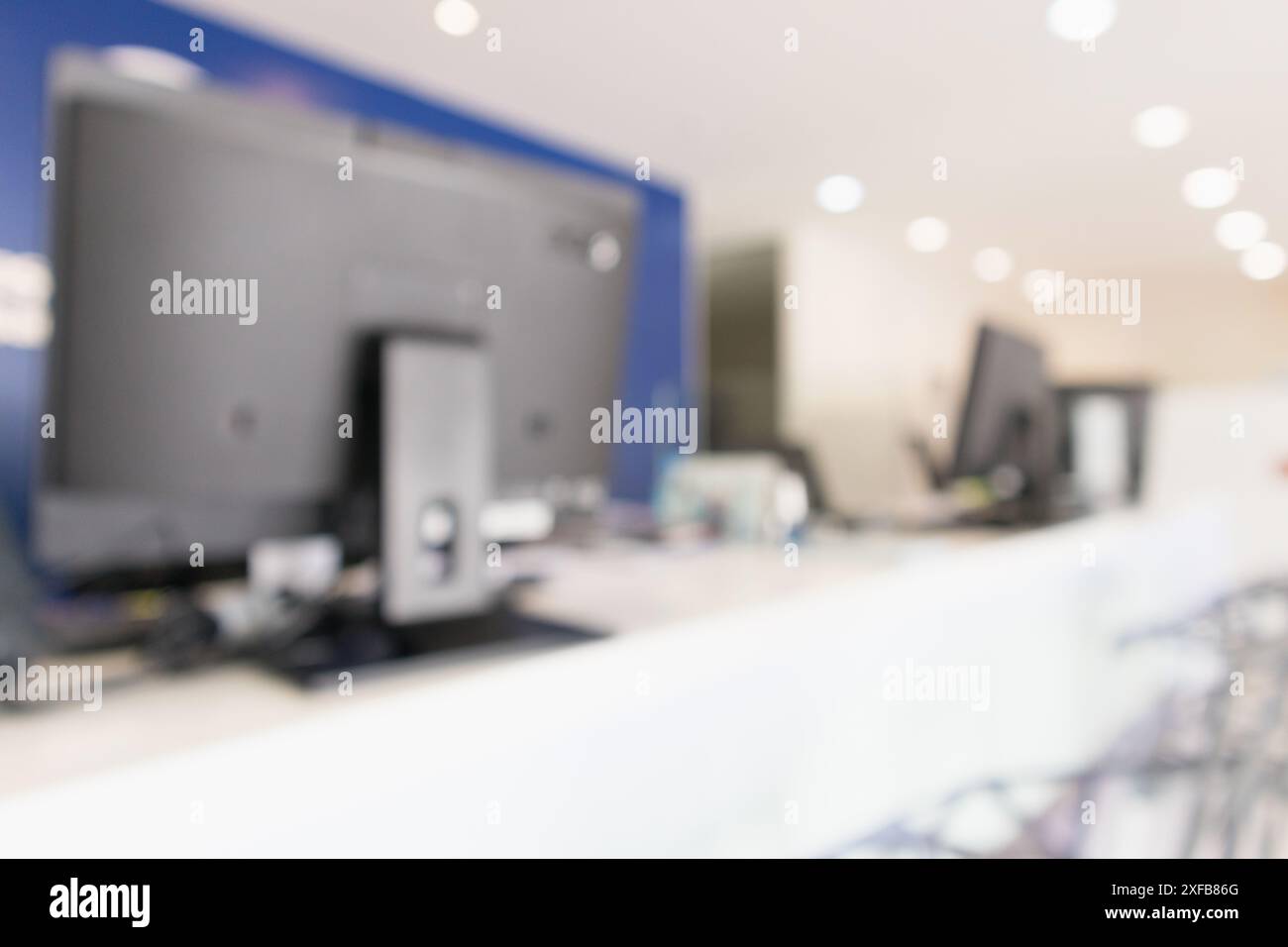 Abstract blur office desk workplace or hospital with computer defocused ...