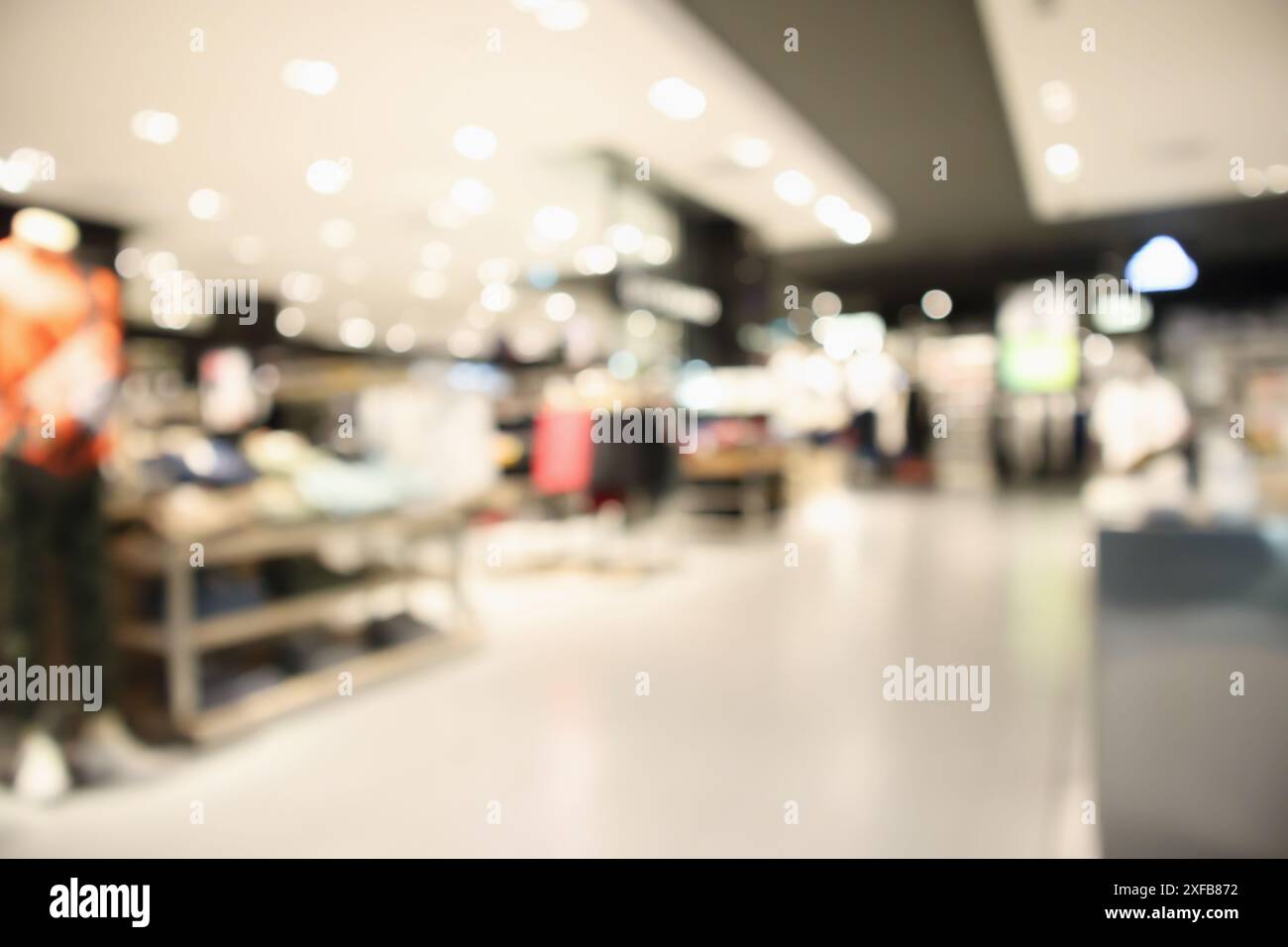 Abstract blur clothing boutique display interior of shopping mall ...