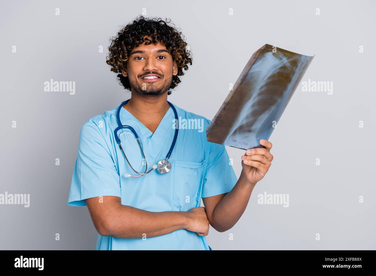 Photo of doctor guy hold x ray examination isolated grey color ...