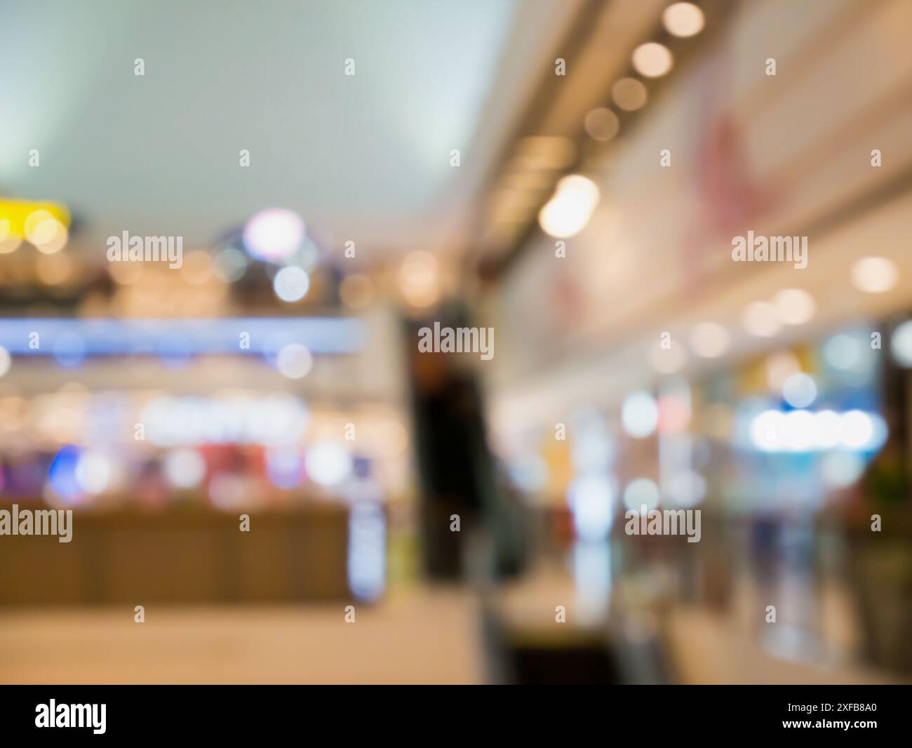 Shopping mall store blur background with bokeh light Stock Photo - Alamy