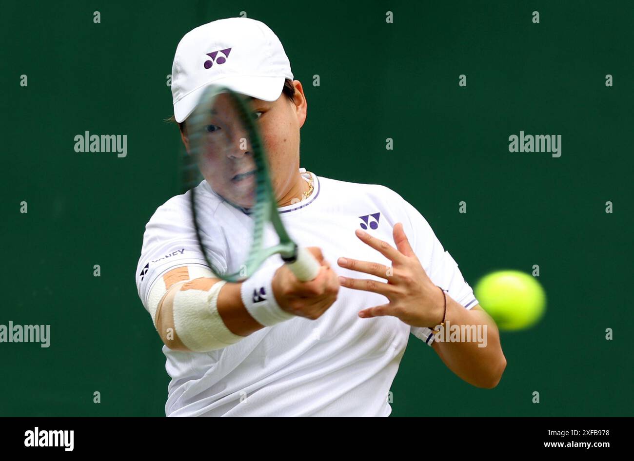 London, Britain. 2nd July, 2024. Bai Zhuoxuan hits a return during the ...