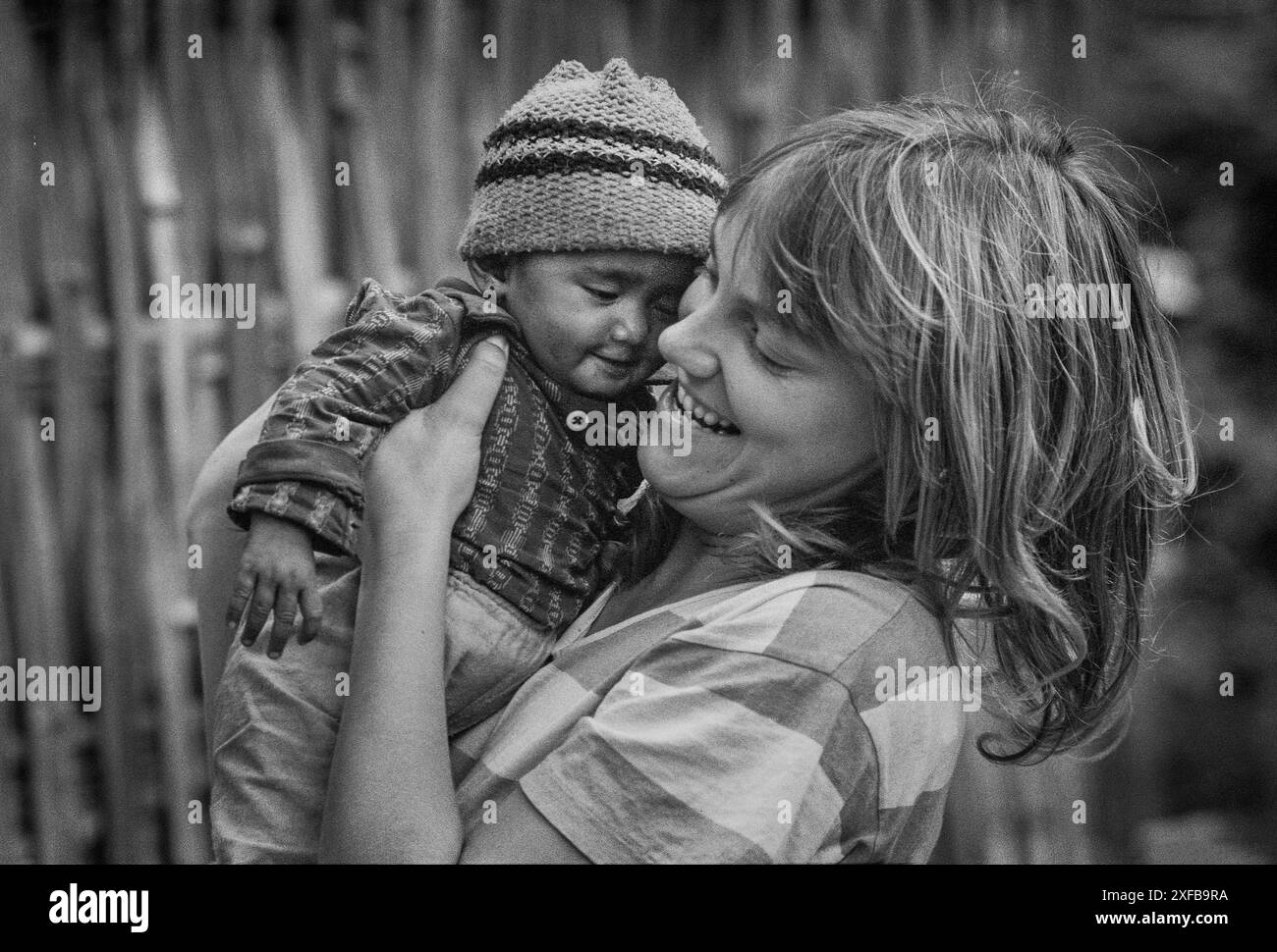 Myanmar, Mandalay - western woman holds a child she received from a ...