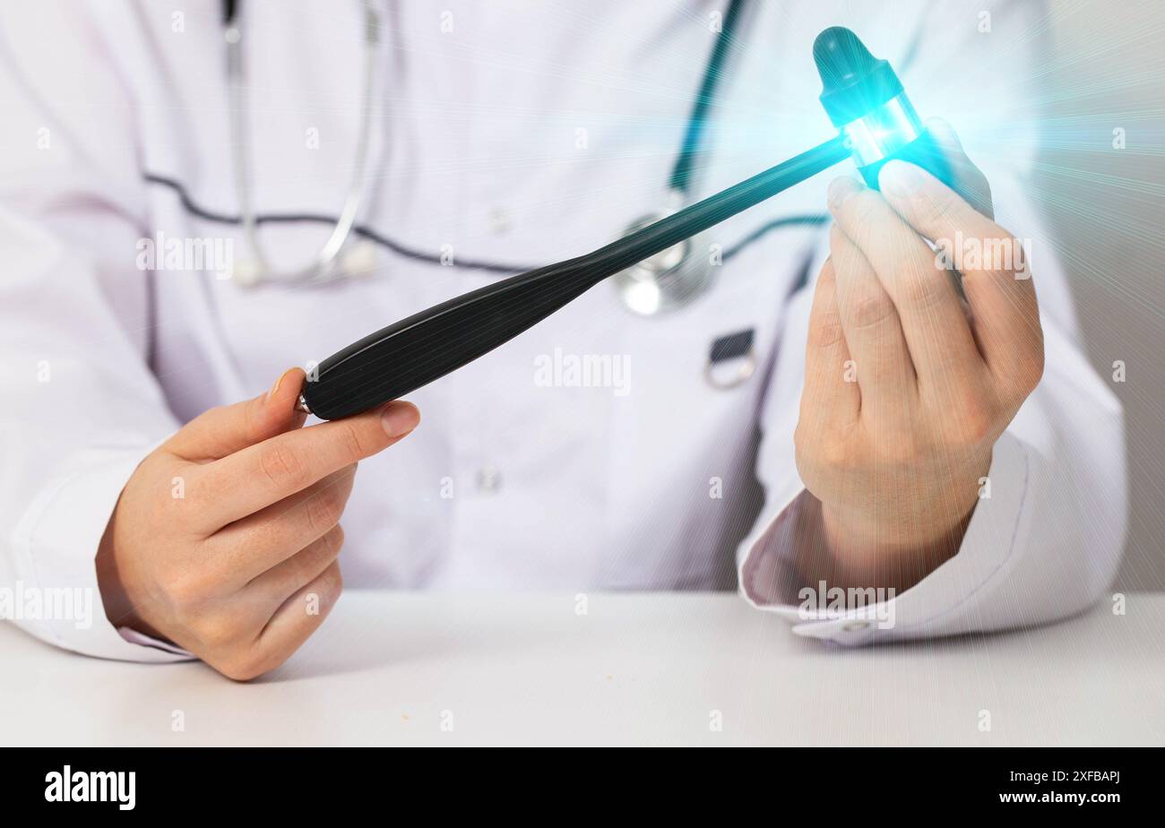A neurological hammer is in the hands of a neurologist. Concept for ...
