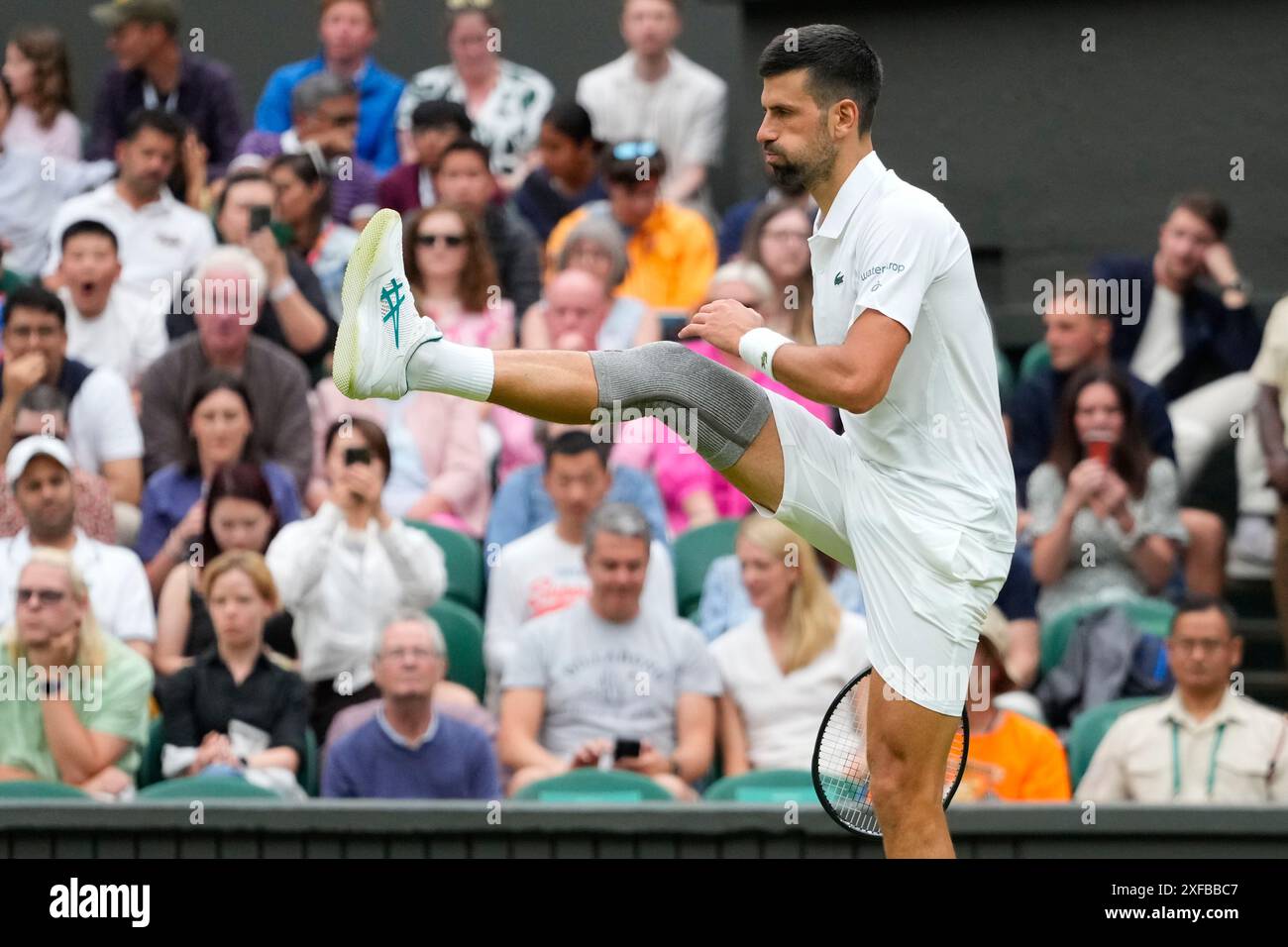 Serbia's Novak Djokovic stretches during his first round match against ...