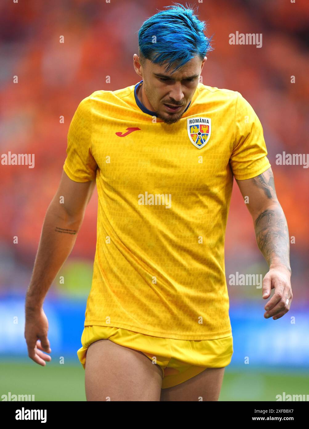 Romania's Andrei Ratiu warming up ahead of of the UEFA Euro 2024, round ...