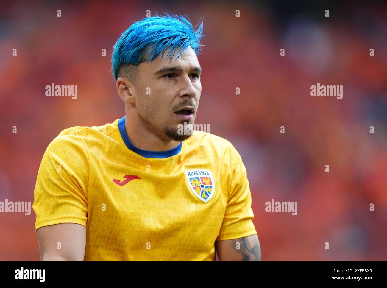 Romania's Andrei Ratiu warming up ahead of of the UEFA Euro 2024, round ...