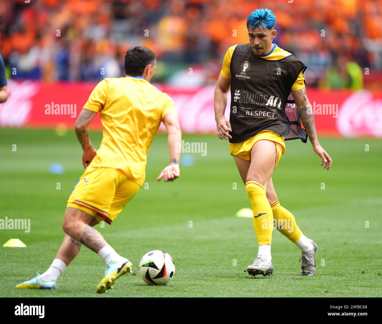 Romania's Andrei Ratiu (right) warming up ahead of of the UEFA Euro ...