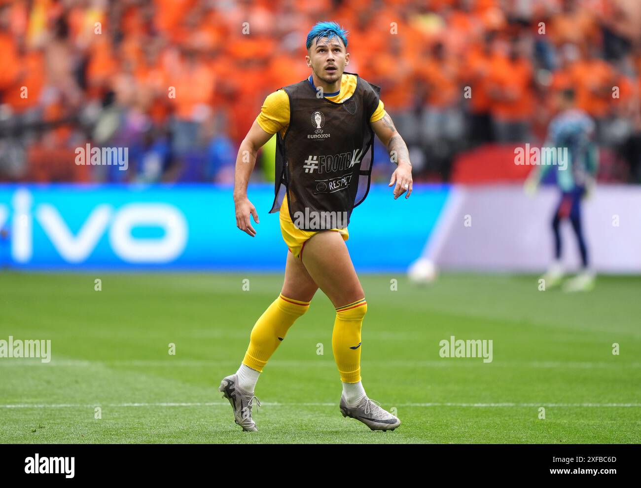 Romania's Andrei Ratiu warming up ahead of of the UEFA Euro 2024, round ...