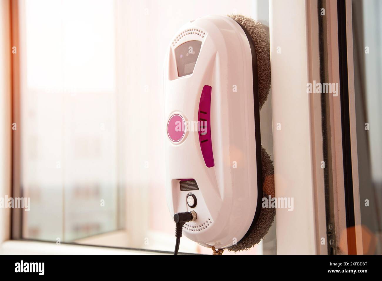 Automatic vacuum robot window washer washes glass from dirt. Modern ...