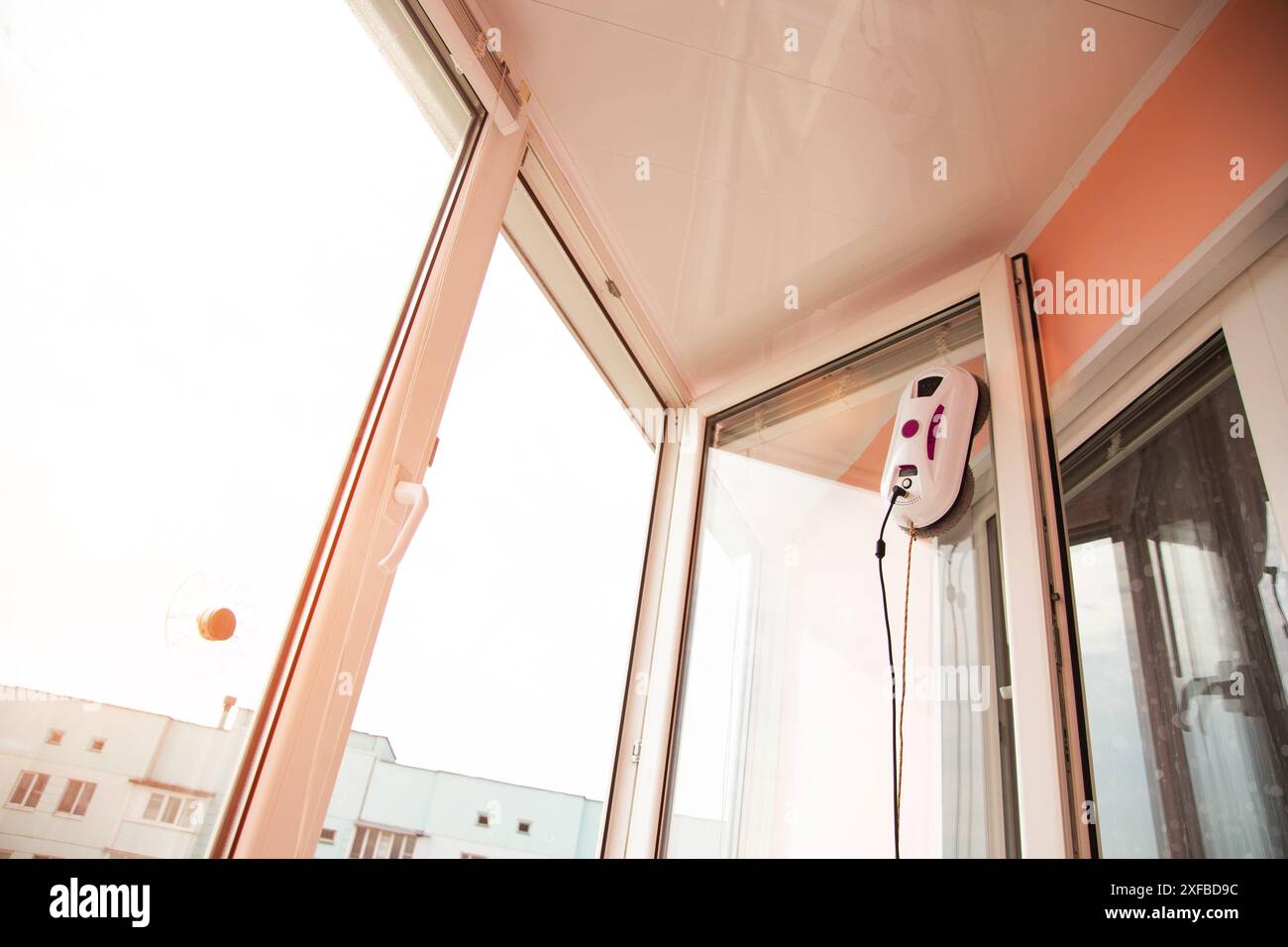 Automatic vacuum robot window washer washes glass from dirt. Modern ...