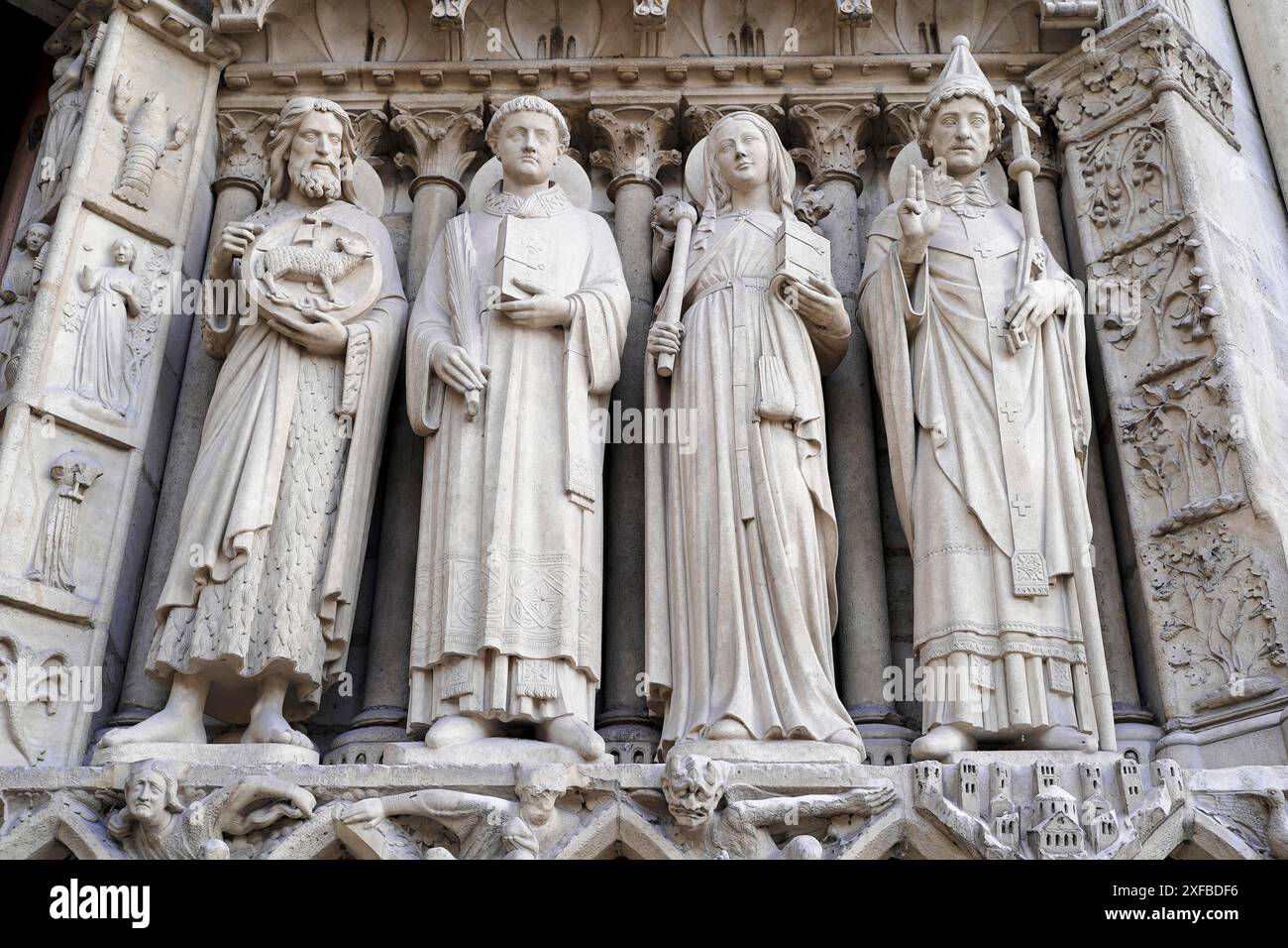 Figures of saints, Detail of the Gothic entrance portal of Notre Dame ...