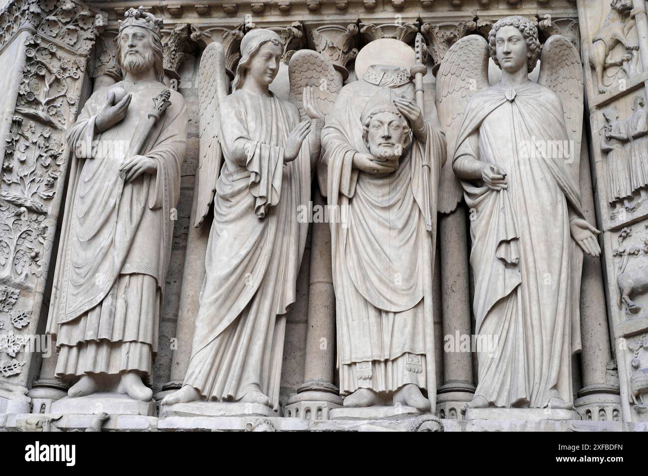 Figures of saints, Detail of the Gothic entrance portal of Notre Dame ...